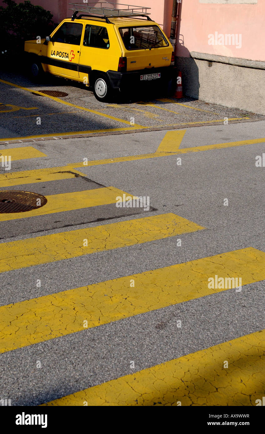 Zebra crossing and a parked yellow car, Switzerland Stock Photo - Alamy