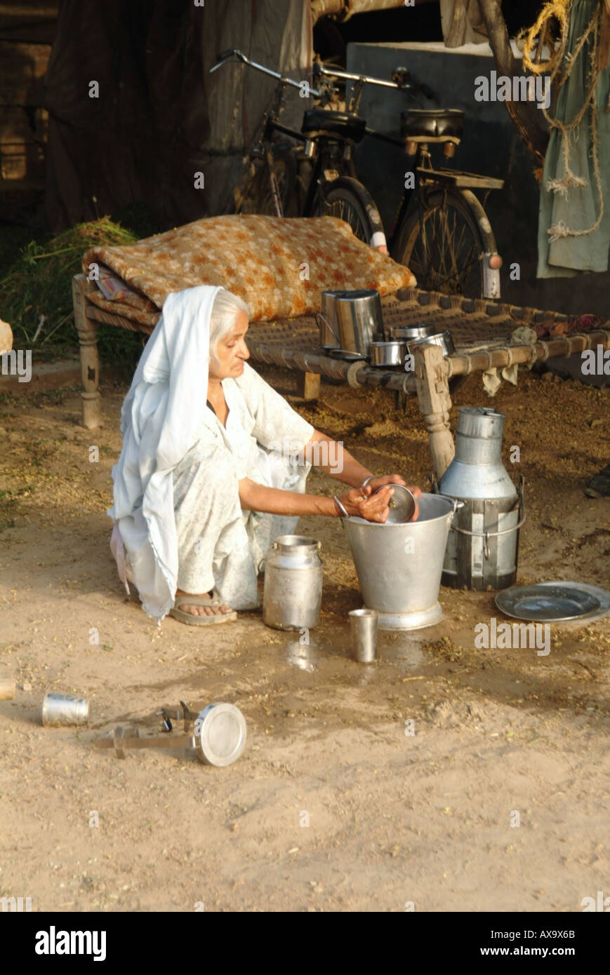 Woman Washing Utensils on a Farm Stock Photo - Alamy