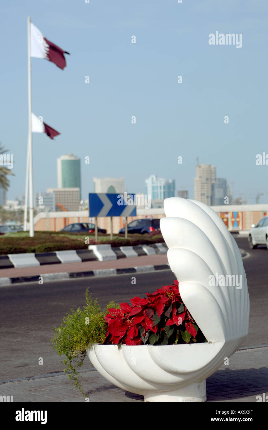 Municipal flowers planted in a pearl shell shaped pot in Doha, Qatar ...