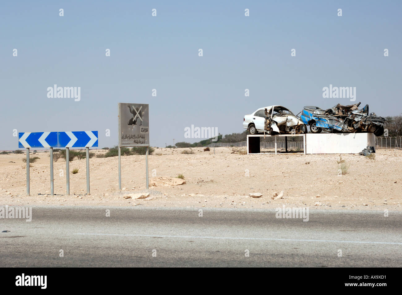 Car wrecks placed on display along the road side in Qatar as a warning ...