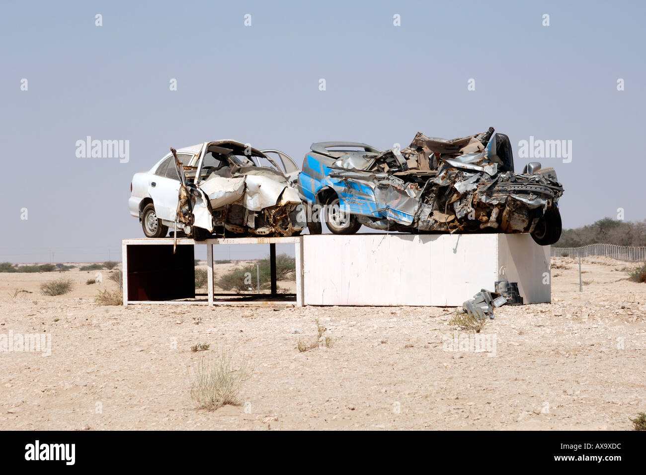 Car wrecks placed on display along the road side in Qatar as a warning ...