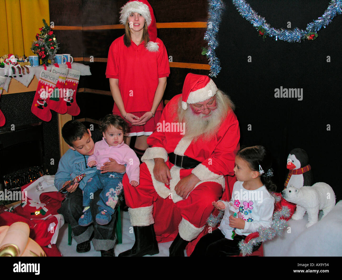 Children visiting santa in christmas hi-res stock photography and ...