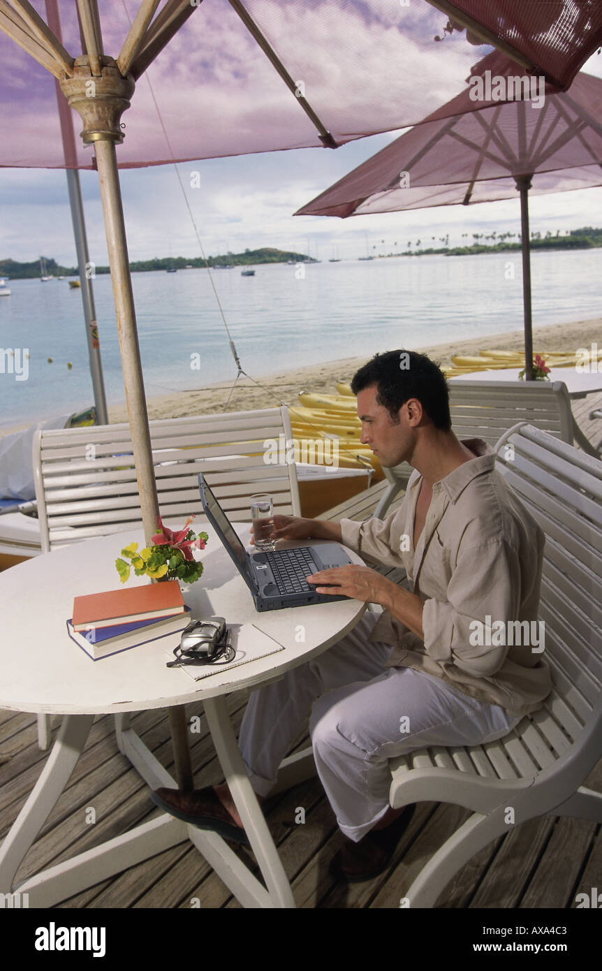 Young man laptop fiji hi-res stock photography and images - Alamy
