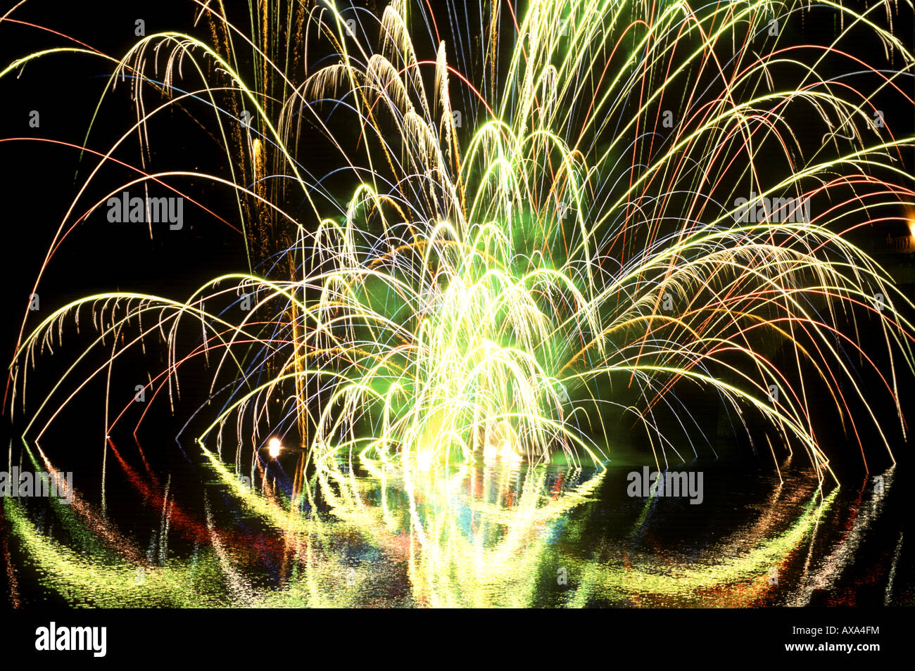 Fireworks reflected in water Stock Photo - Alamy