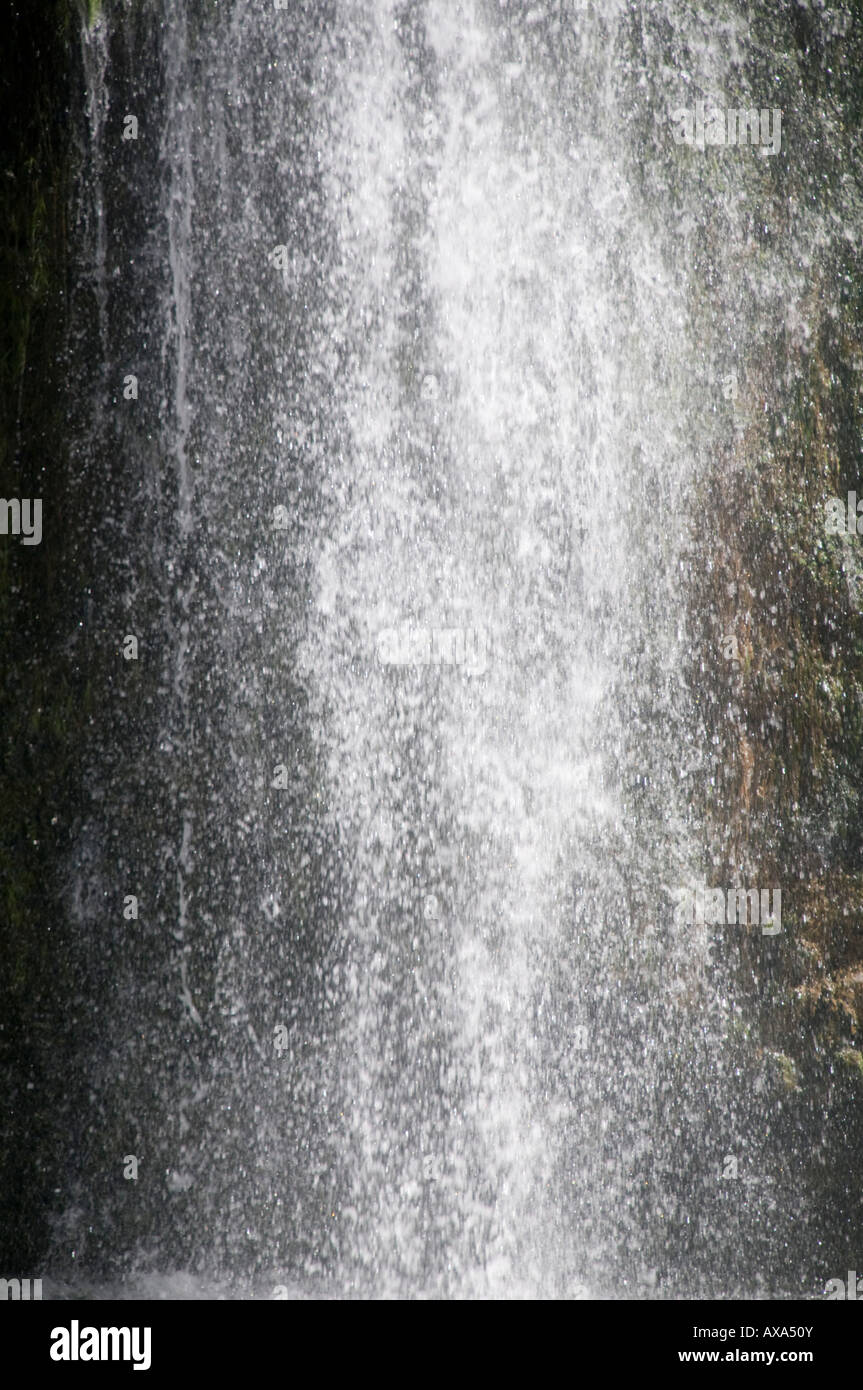 A natural waterfall Conceptual close up of the water splashing into a ...