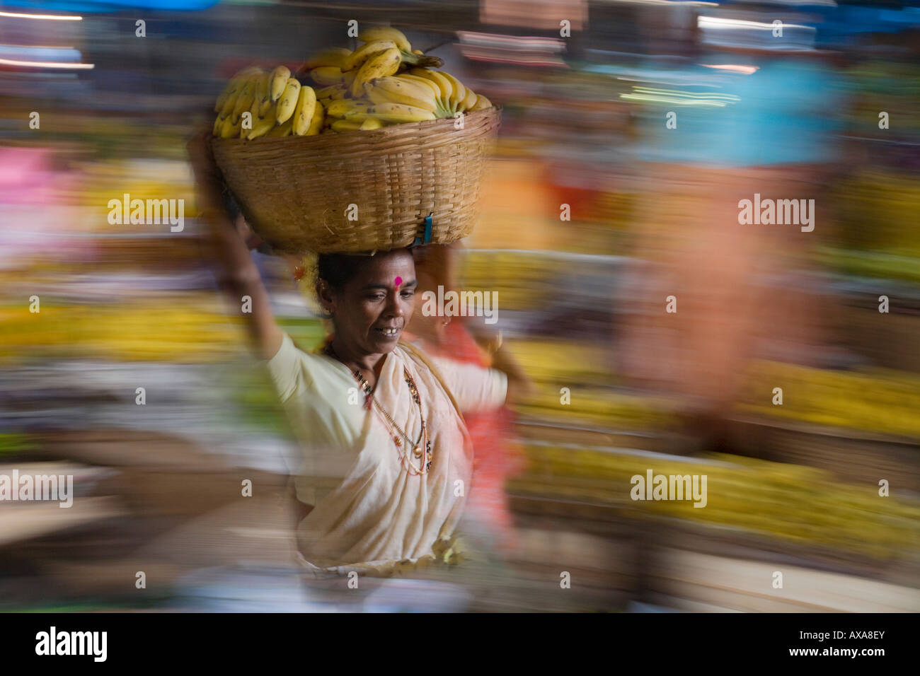 Indian woman carrying basket bananas hi-res stock photography and ...