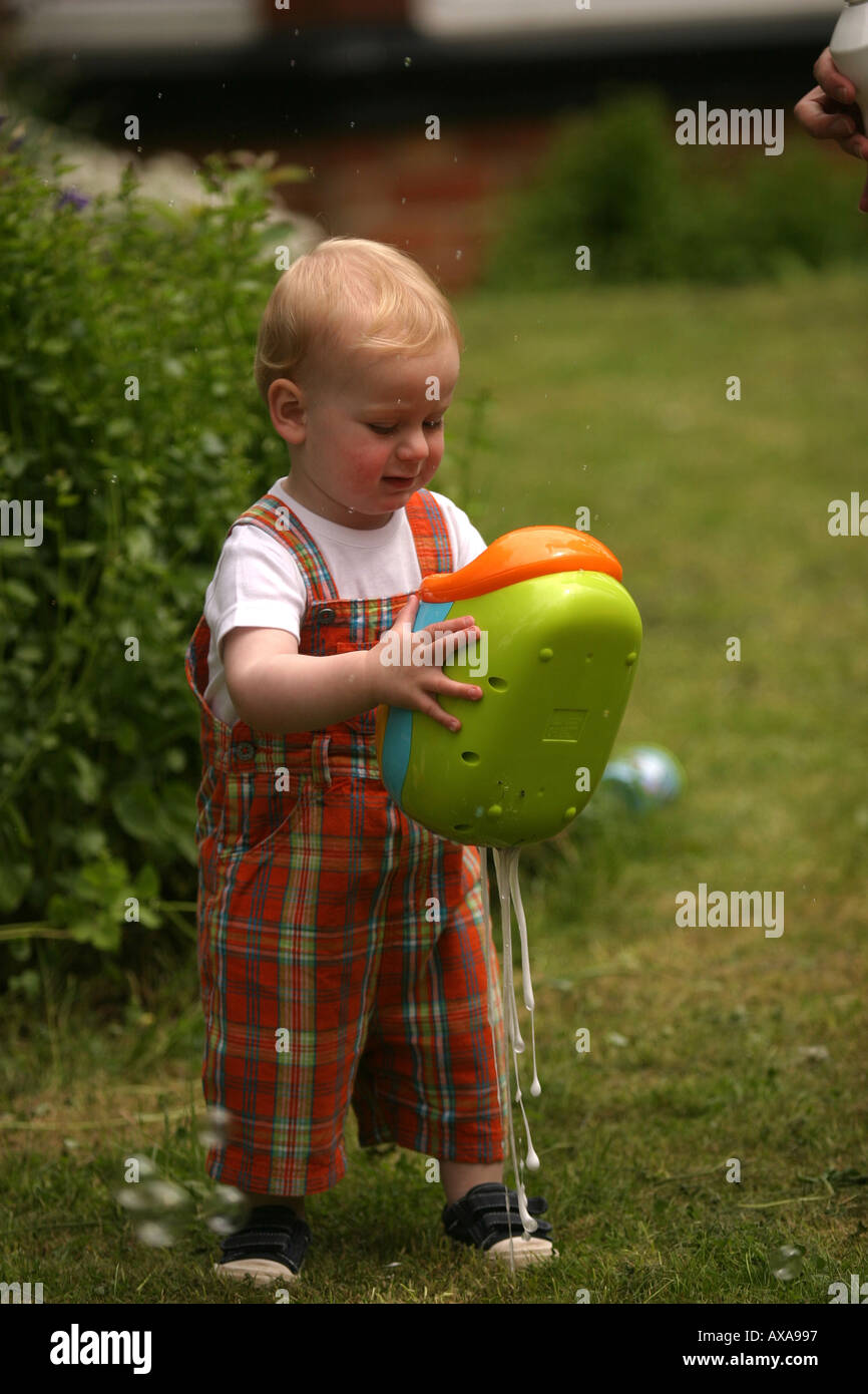 Boy running around grass hi-res stock photography and images - Alamy
