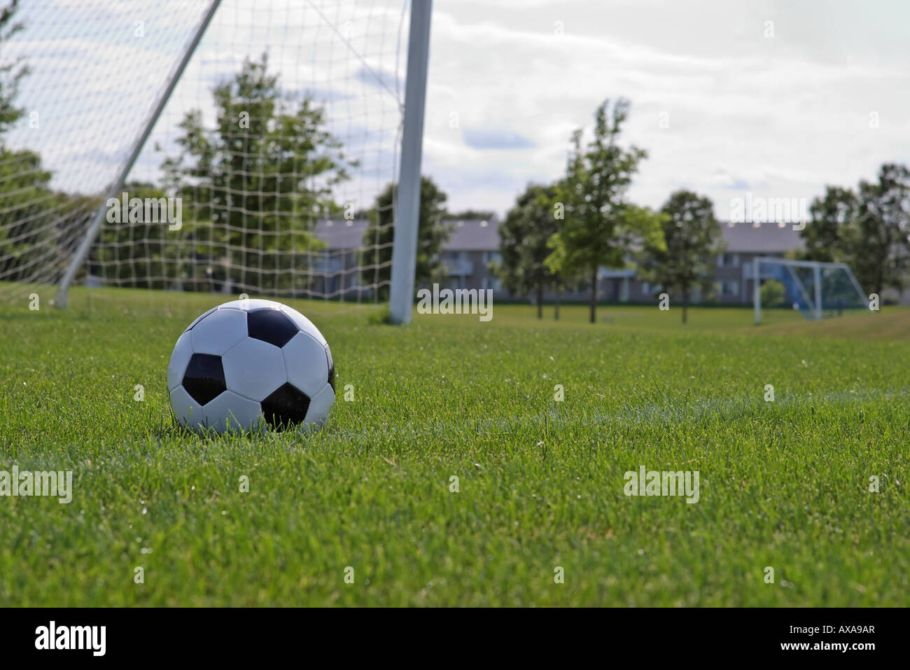 Soccer ball close up with goal in the background Stock Photo - Alamy