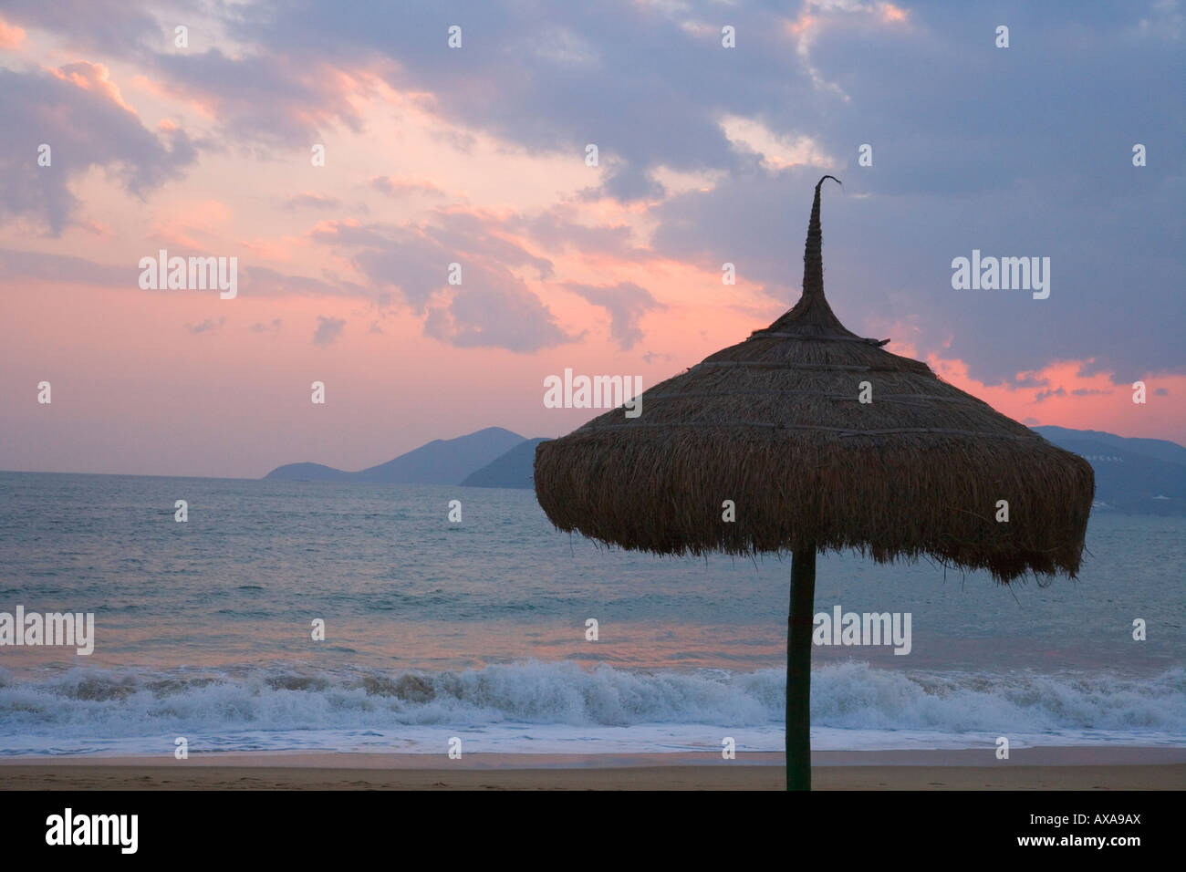 Straw canopy on the beach at sunrise Nha Trang Vietnam Stock Photo - Alamy