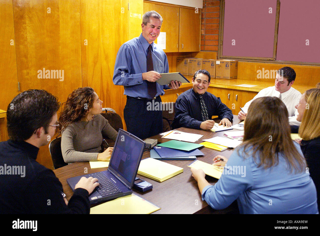 Group of young adults discuss club project Stock Photo - Alamy
