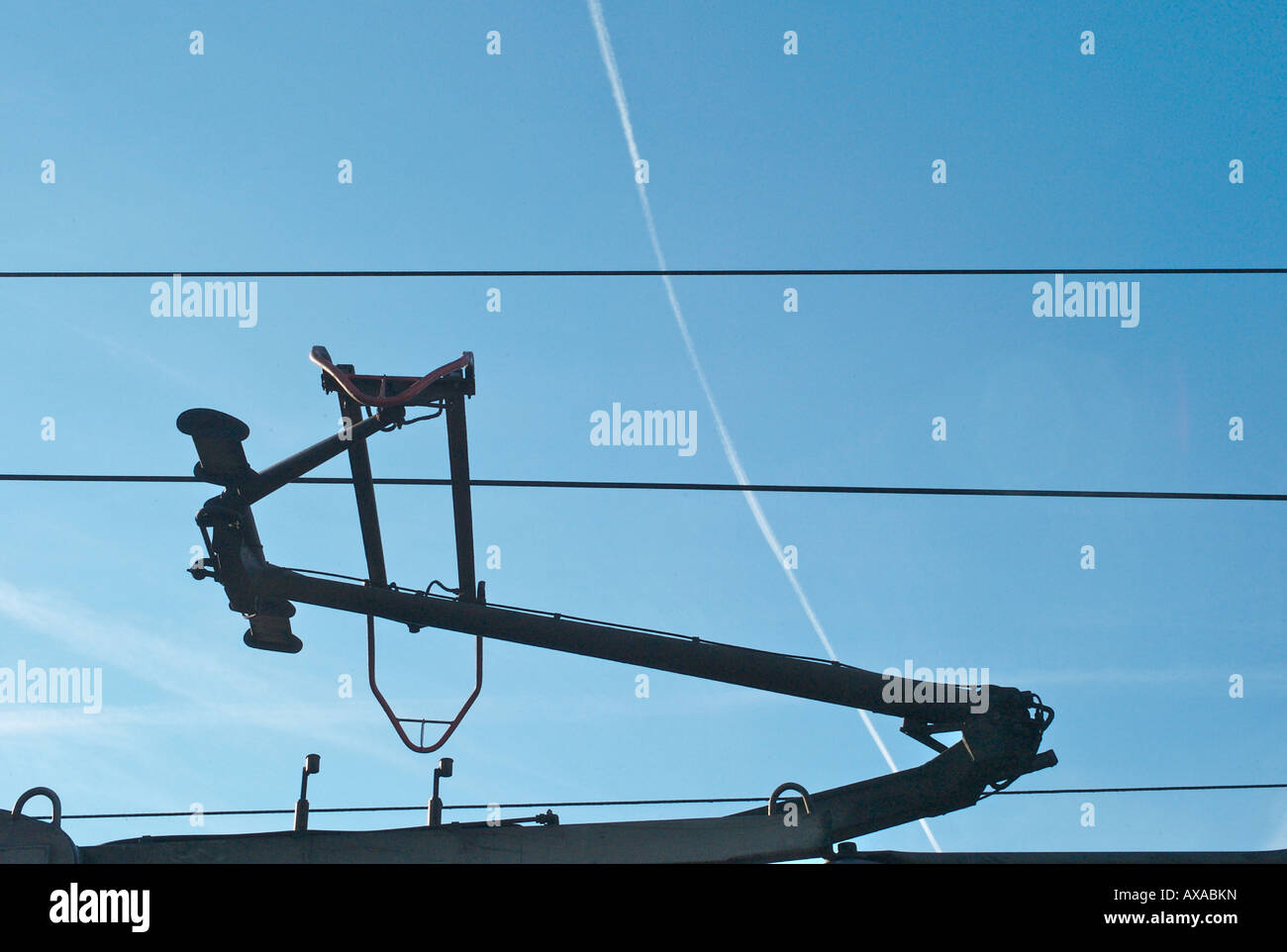 train's electric link in the blue sky background Stock Photo - Alamy