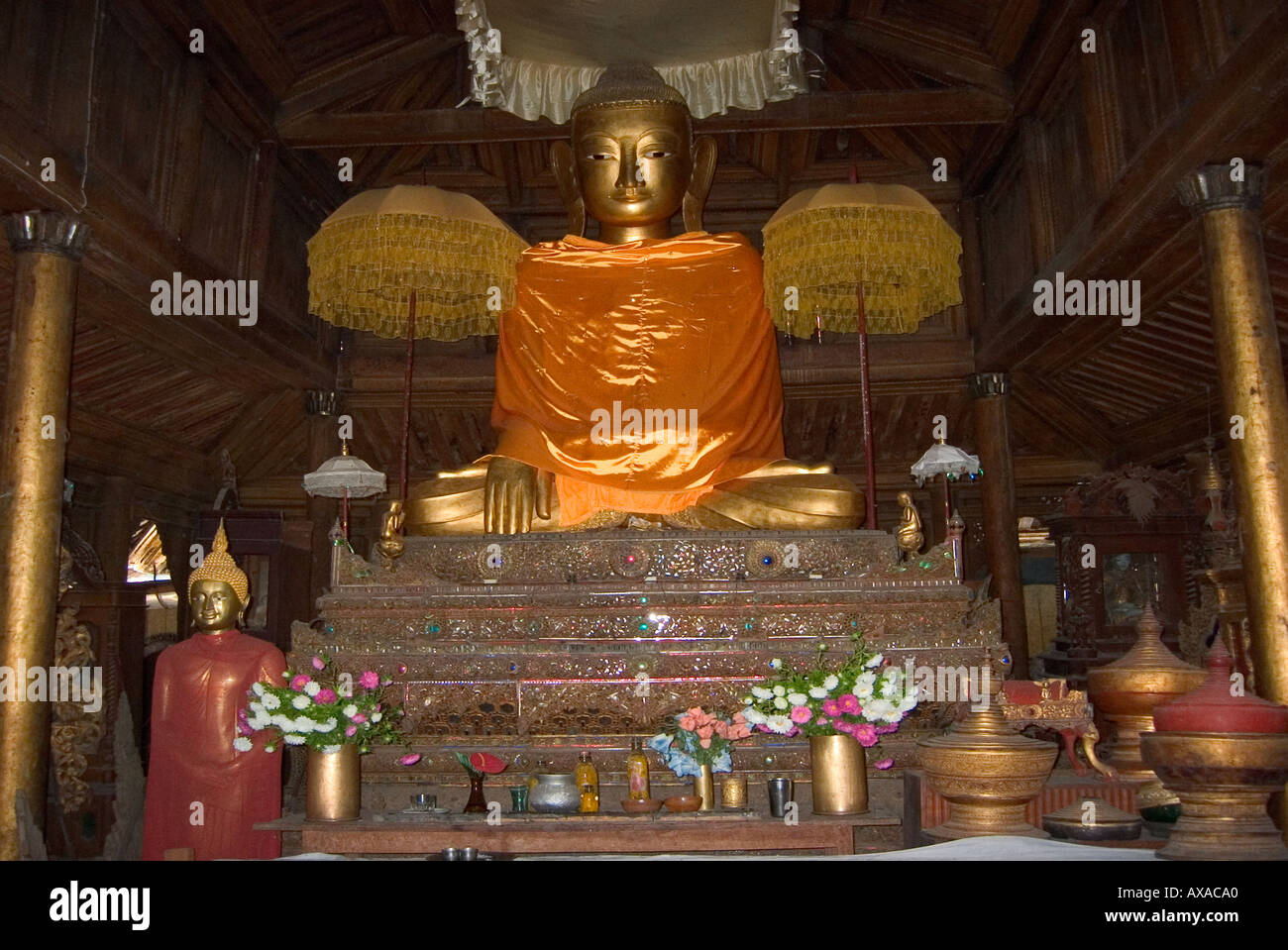 Saffron robe Buddha statue at wooden Shwe Yaunghwe Kyaung monastery at ...