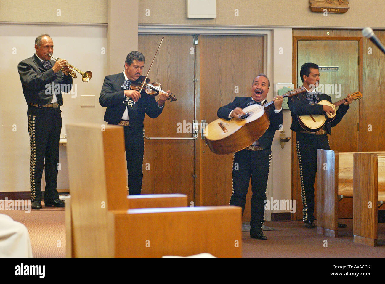 Mexican mariachi musicians play and sing in church setting Stock Photo ...