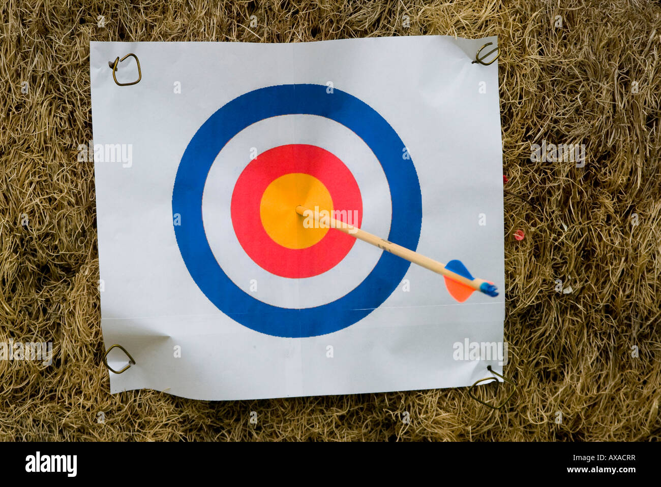 Arrow hits bullseye of target Stock Photo - Alamy Arrow hits bullseye of target Stock Photo - Alamy