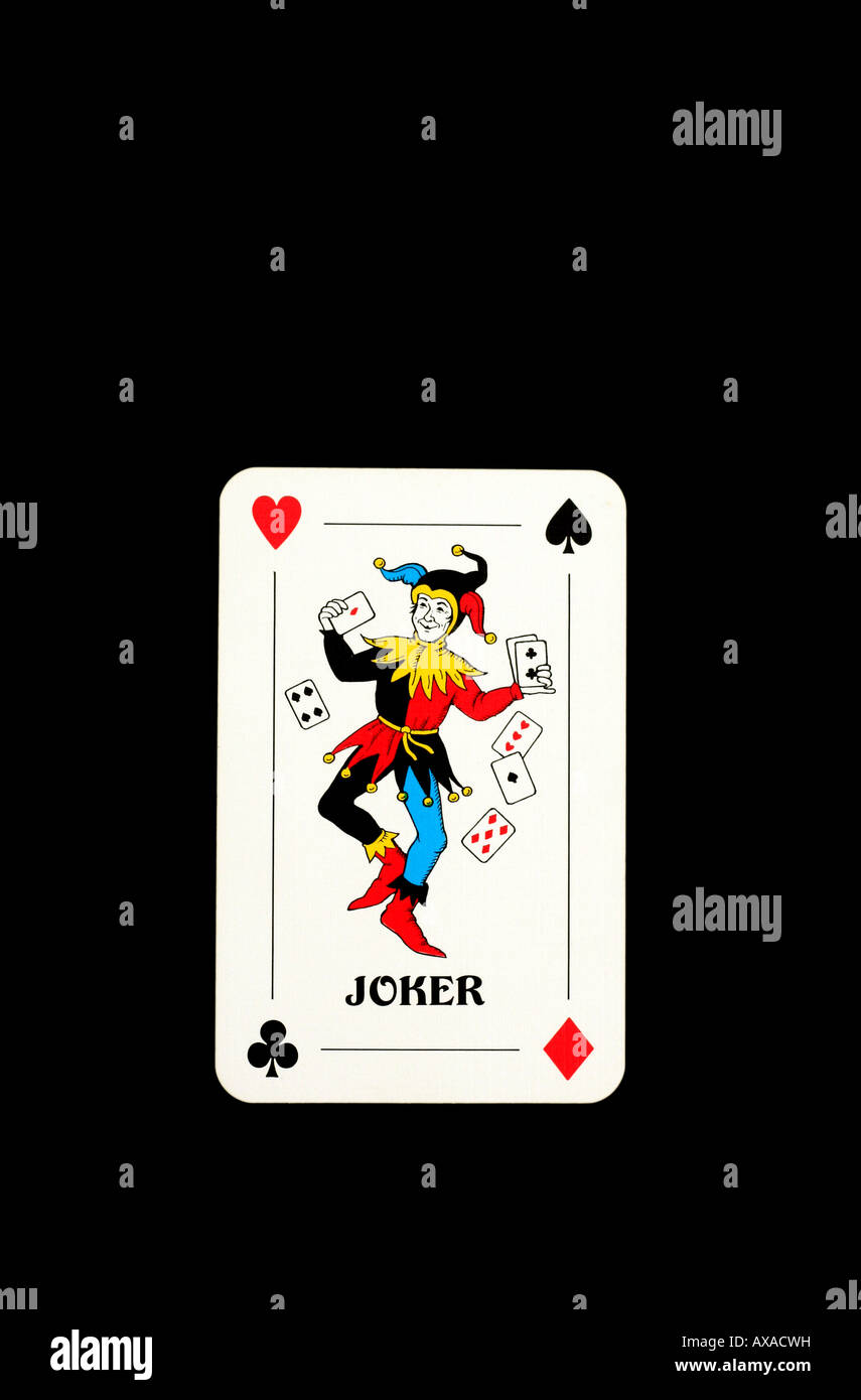 Joker playing card on a black background Stock Photo - Alamy