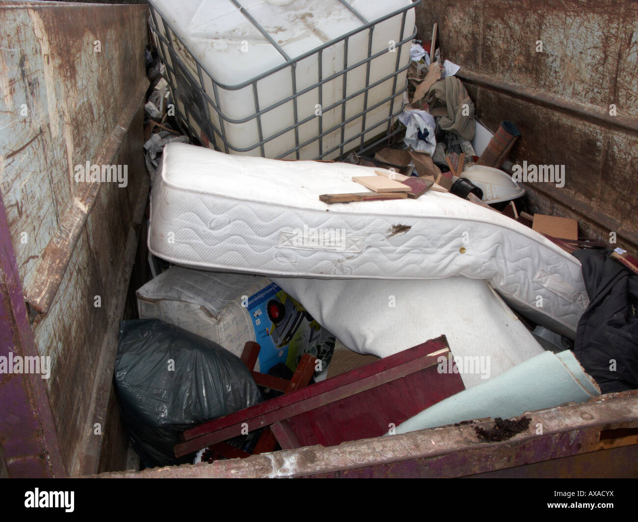 pile of rubbish building up in a rubbish skip at waste depot in the uk ...