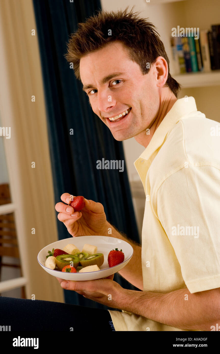 Close up man eating banana hi-res stock photography and images - Alamy