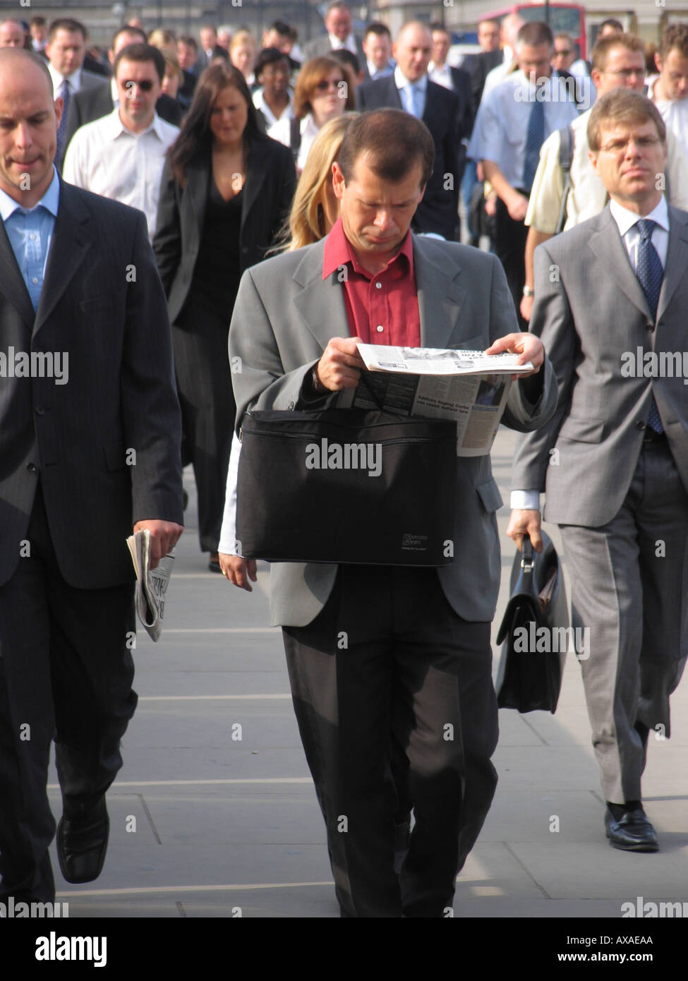 Man reading while walking, London, England Britain, UK Stock Photo - Alamy