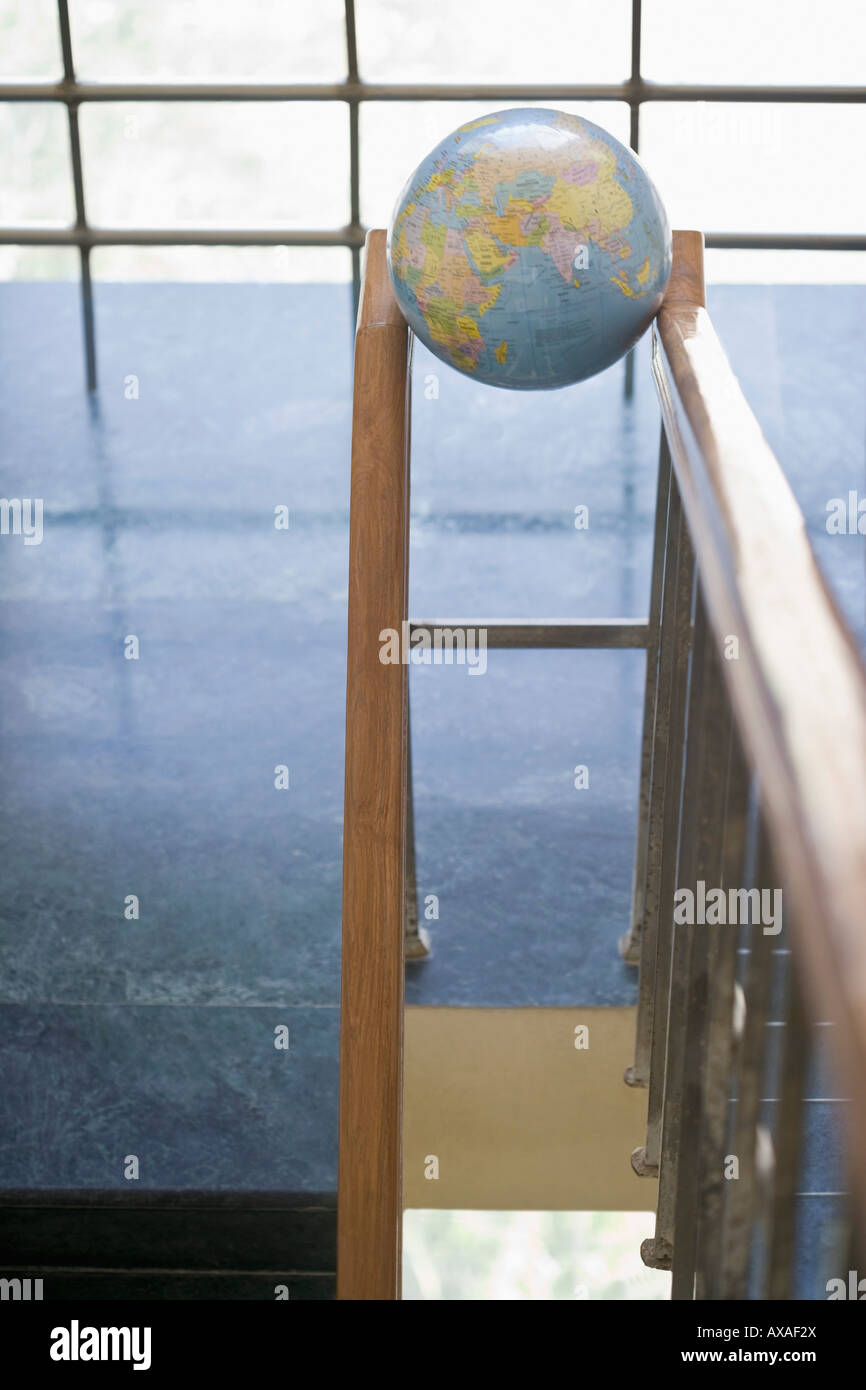 High angle view of a globe between the railings of a staircase Stock ...