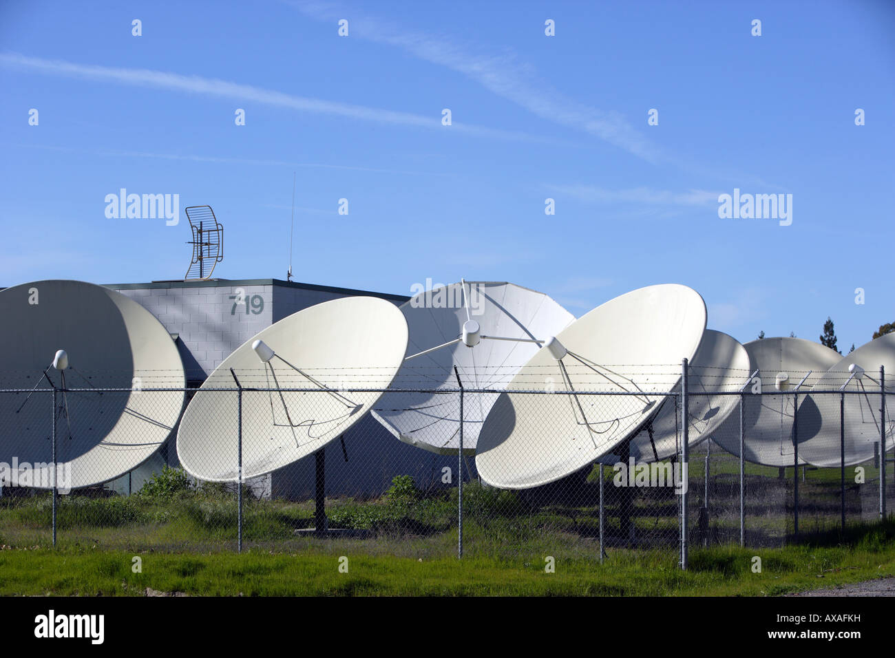 A satellite dish station with several dishes transmiting and receiving ...