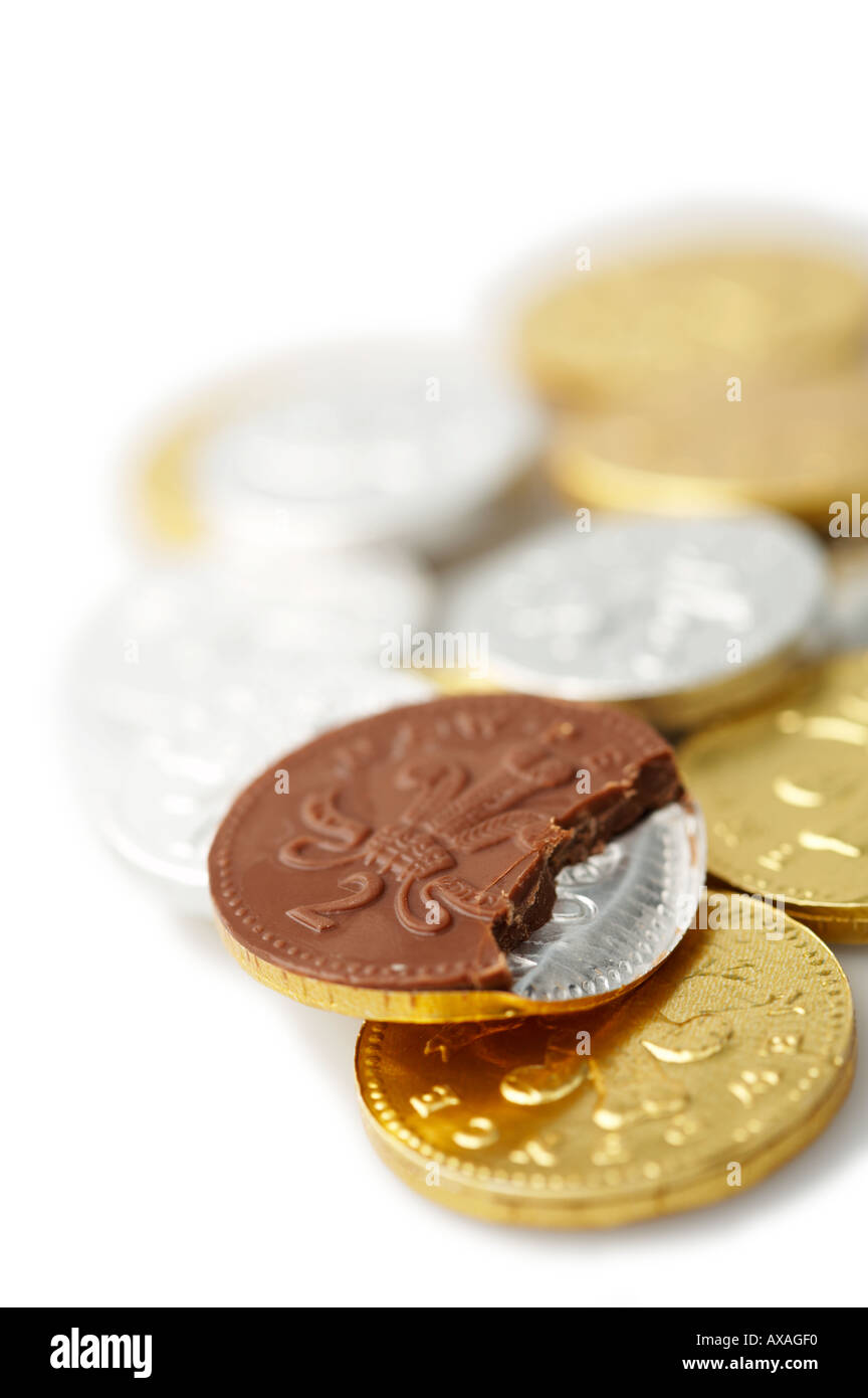 Chocolate money eating your savings Stock Photo - Alamy