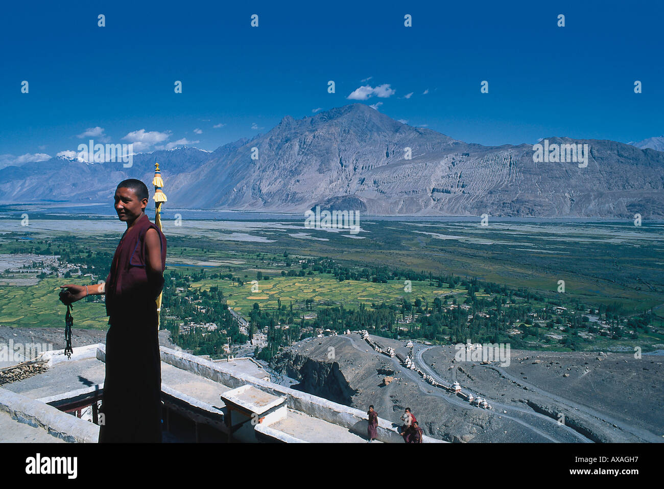 Monks and the Lamaist Monastery above Nubra valley, Ladakh, India Stock ...