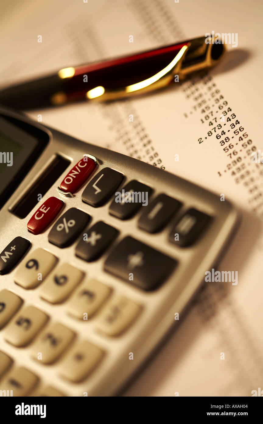 Calculator pen and accounts ledger Stock Photo - Alamy