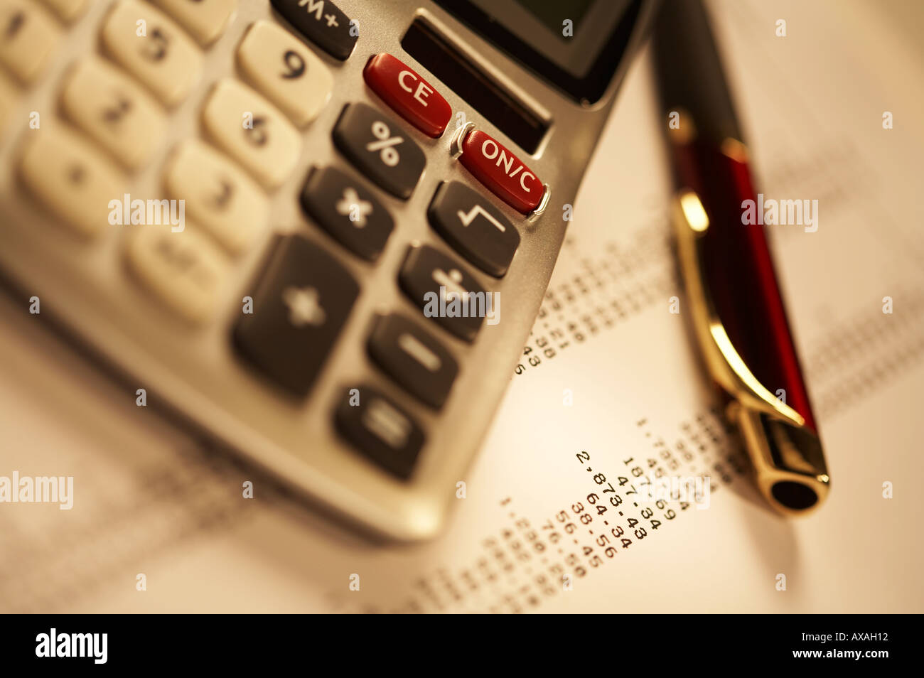 Calculator pen and accounts ledger Stock Photo - Alamy