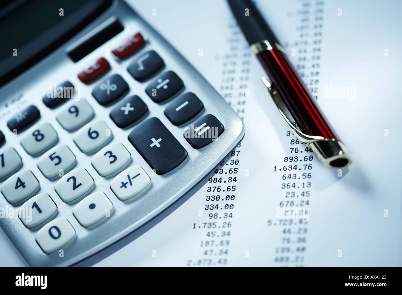 Calculator pen and accounts ledger Stock Photo - Alamy