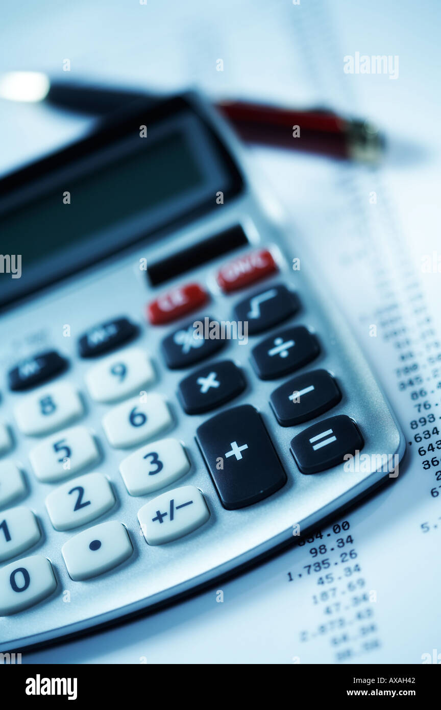 Calculator pen and accounts ledger Stock Photo - Alamy