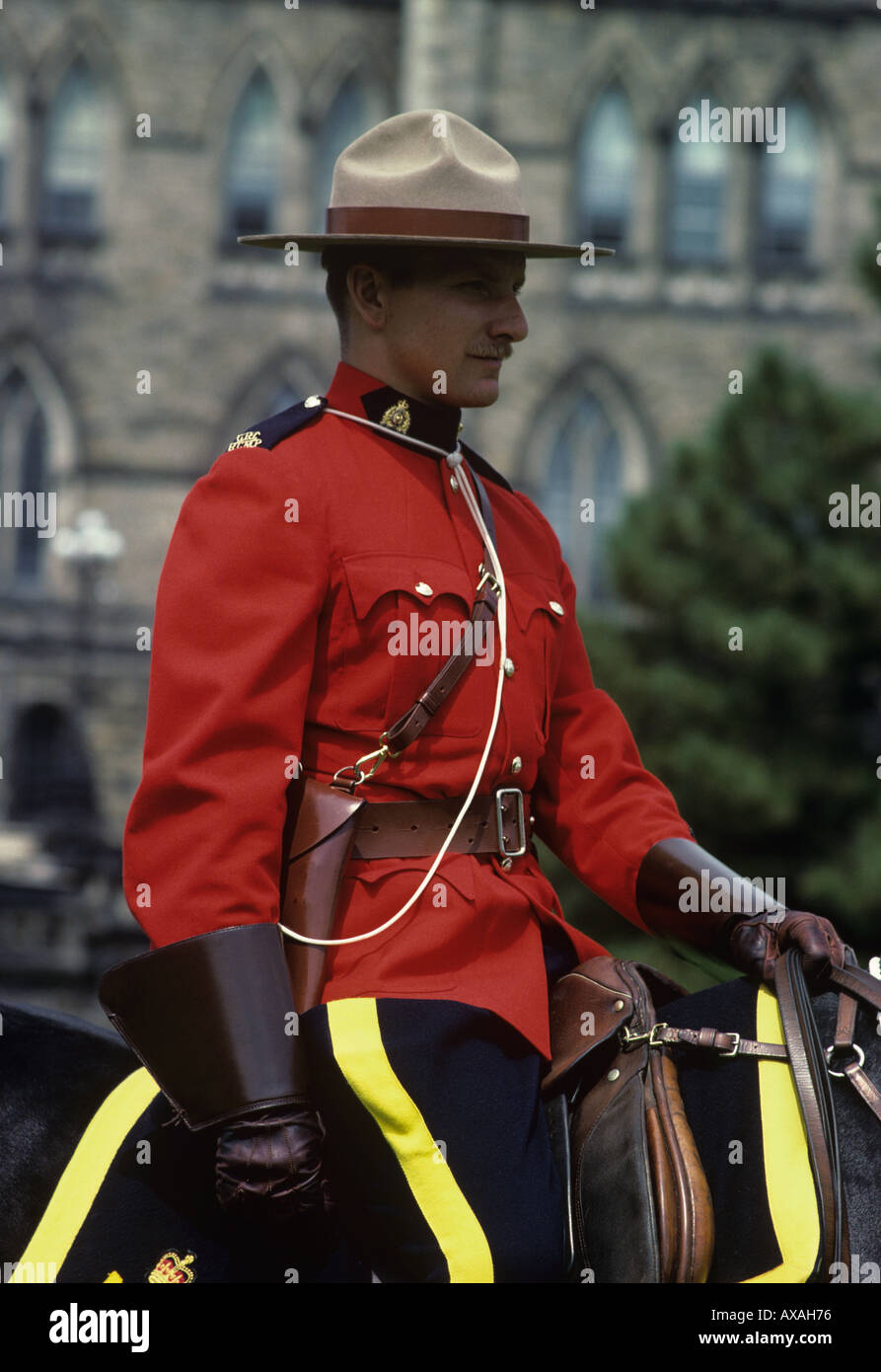 Handsome young Mountie on horseback on guard at Parliament buildings ...
