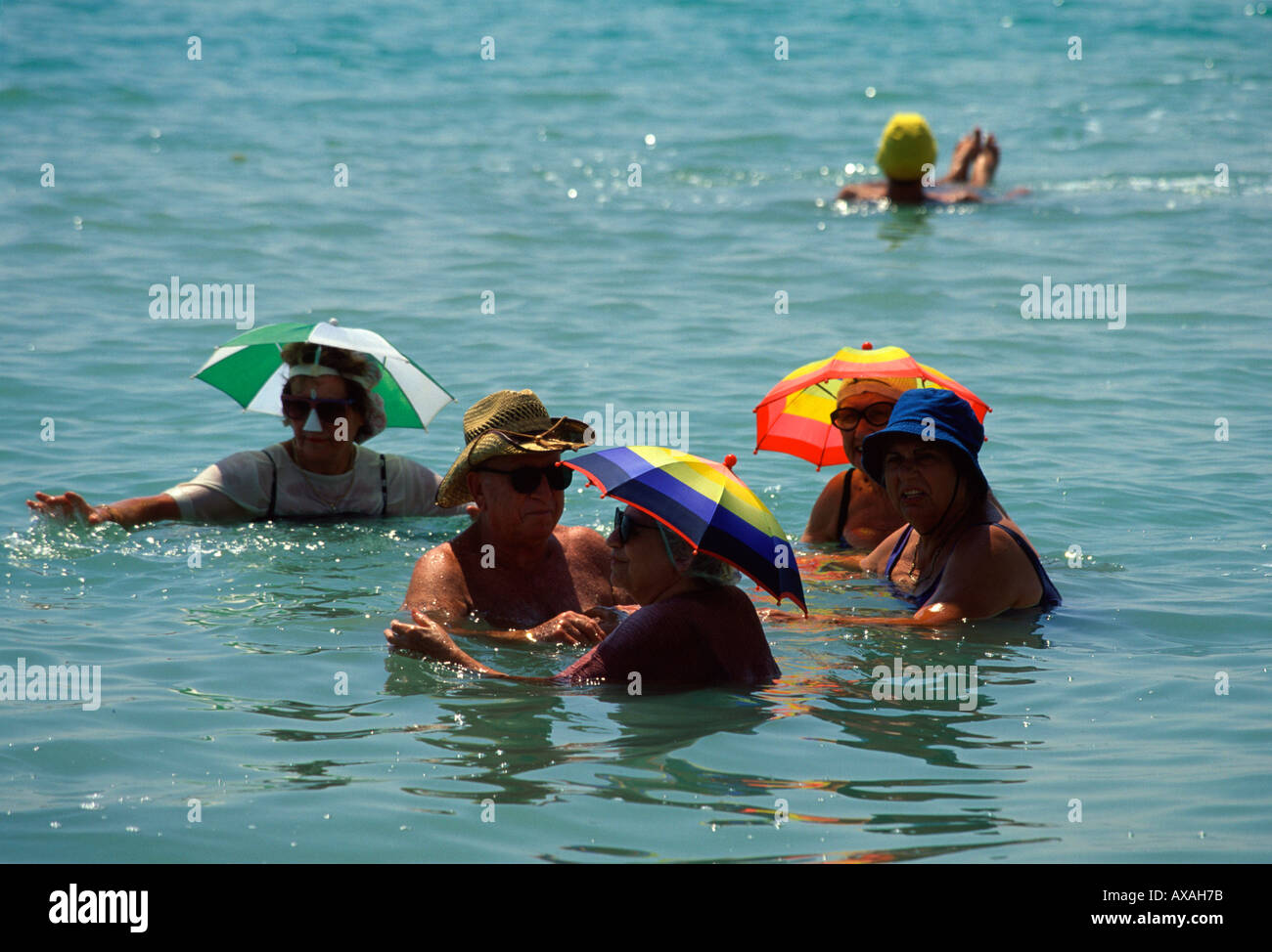 People bathing at the salty waters of the Dead Sea Israel Stock Photo ...