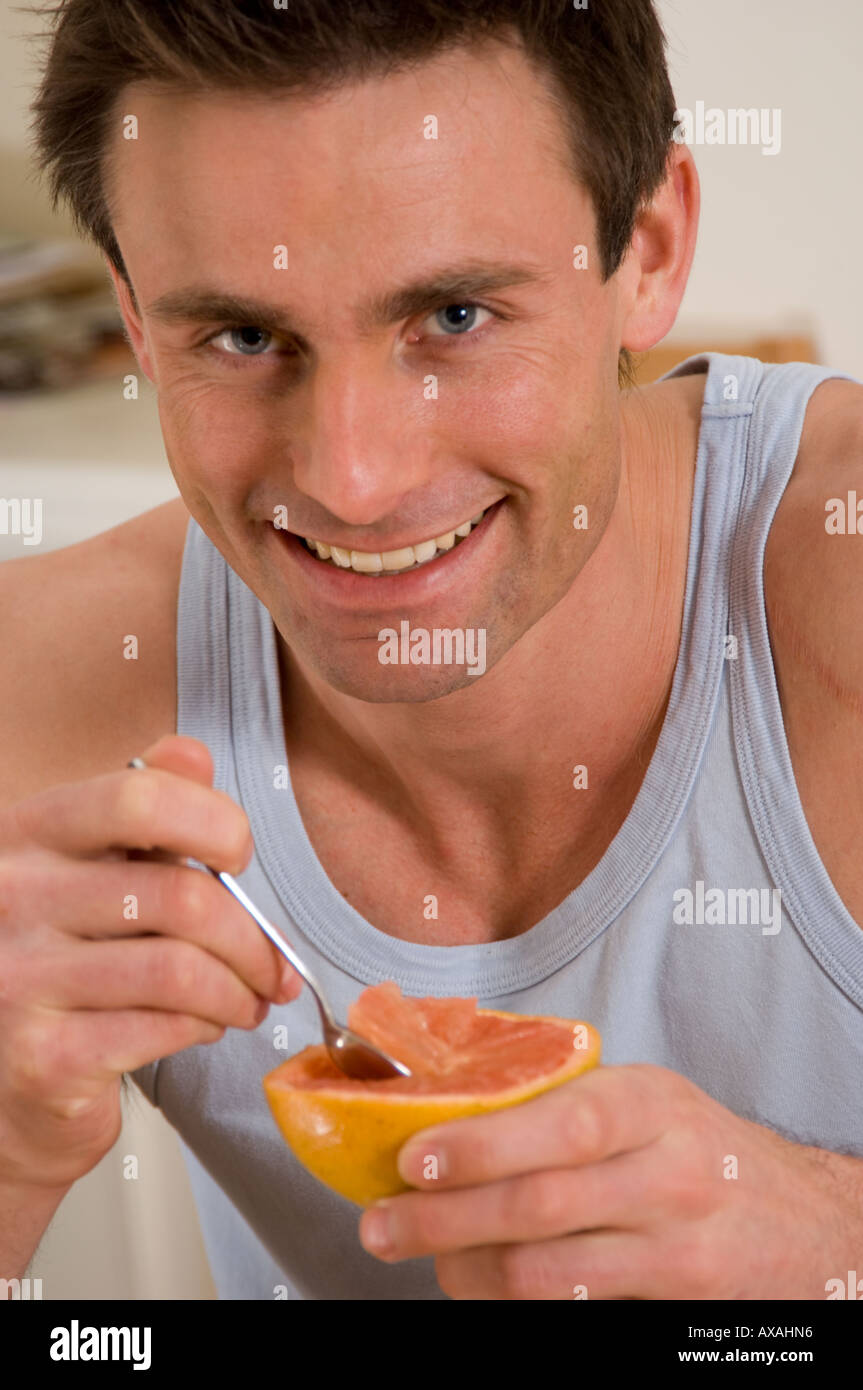 Close up man eating grapefruit hi-res stock photography and images - Alamy