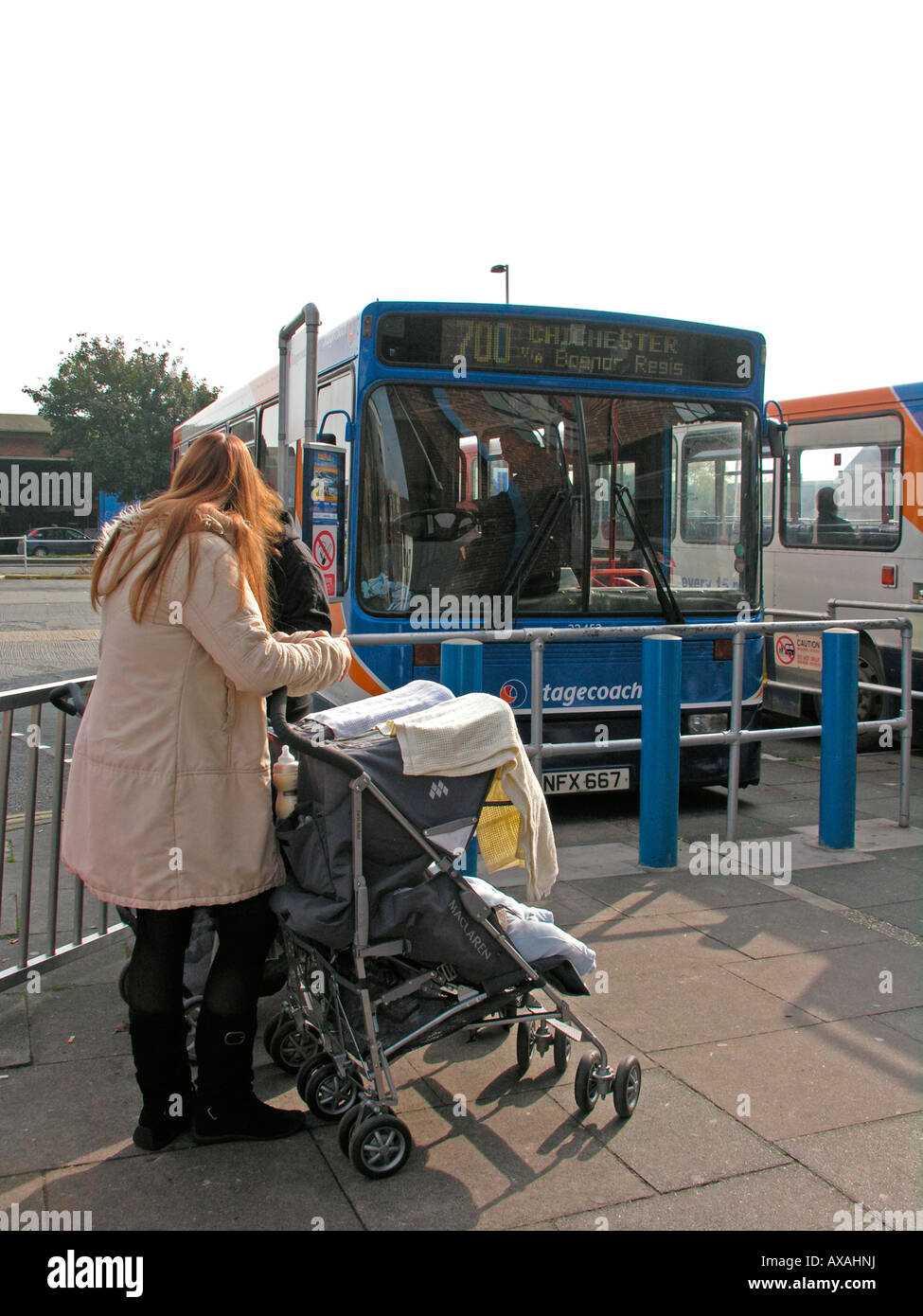 Woman pushchair bus hi-res stock photography and images - Alamy