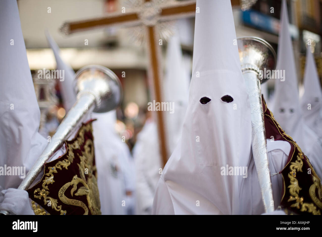 Group of hooded penitents, Palm Sunday, Seville, Spain Stock Photo - Alamy