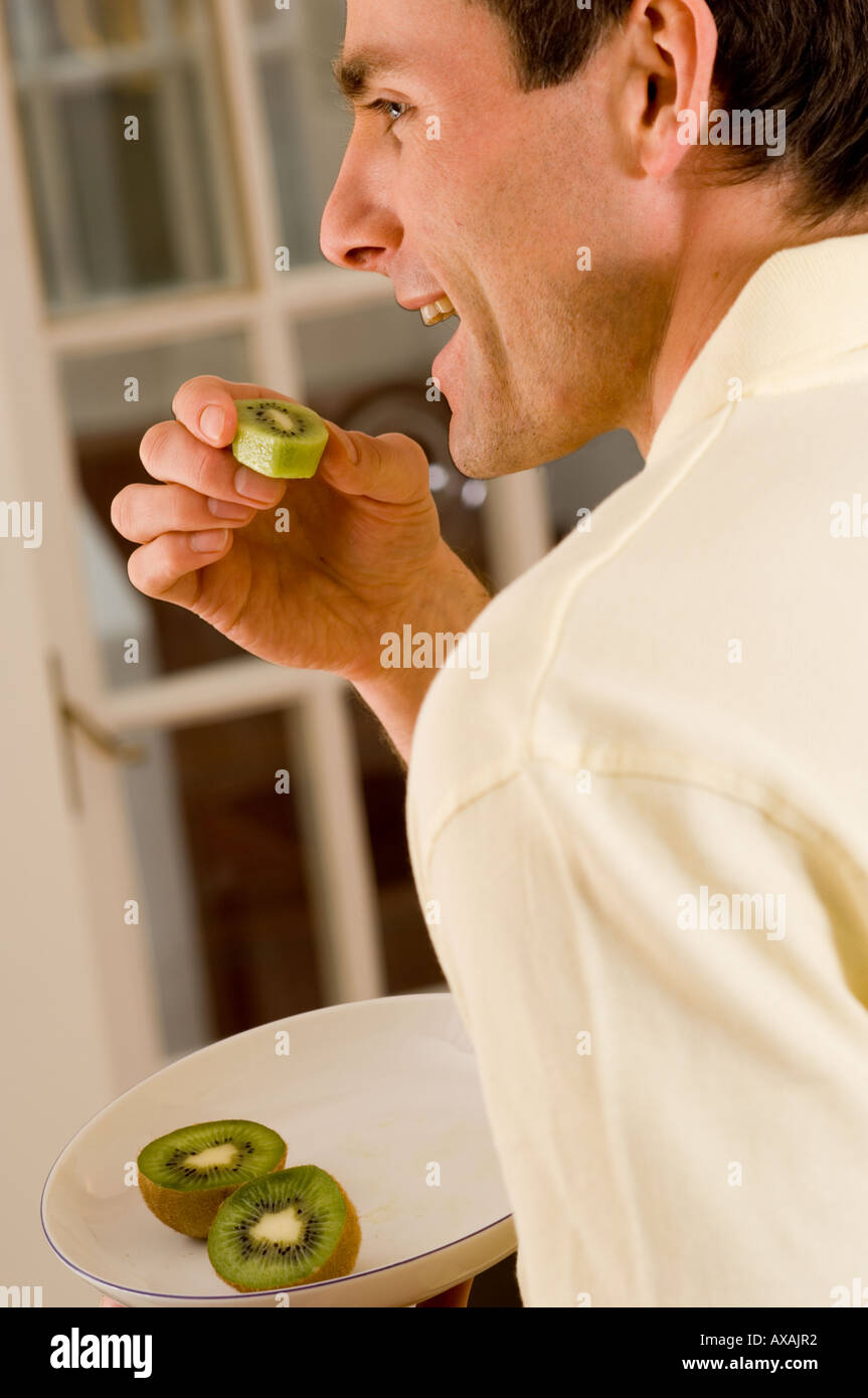 Man eating kiwi fruit hi-res stock photography and images - Alamy