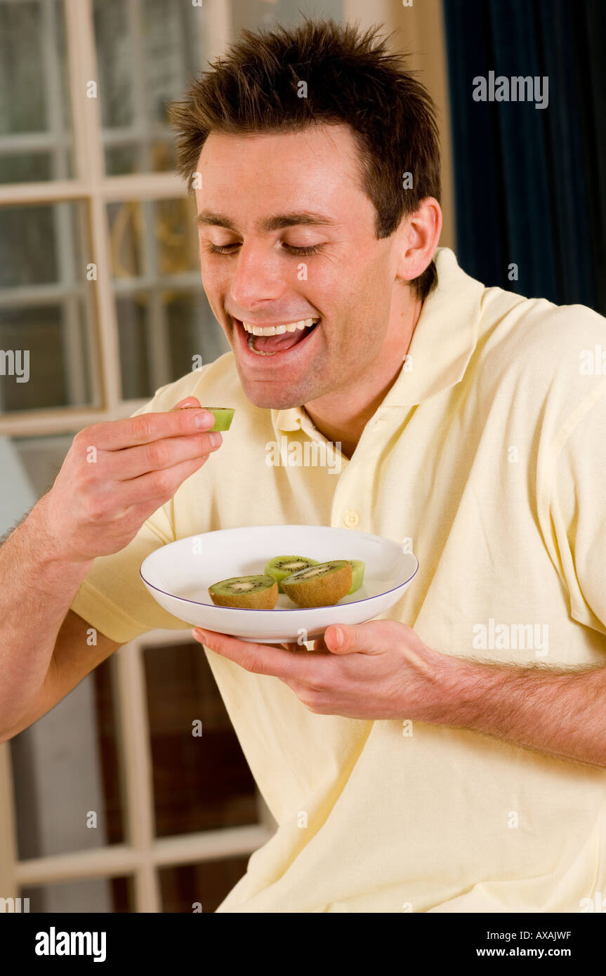 Man eating kiwi fruit hi-res stock photography and images - Alamy
