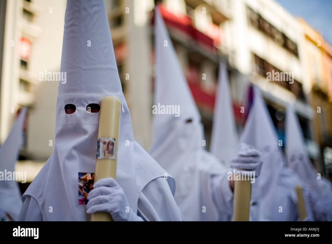 Group of hooded penitents, Palm Sunday, Seville, Spain Stock Photo - Alamy