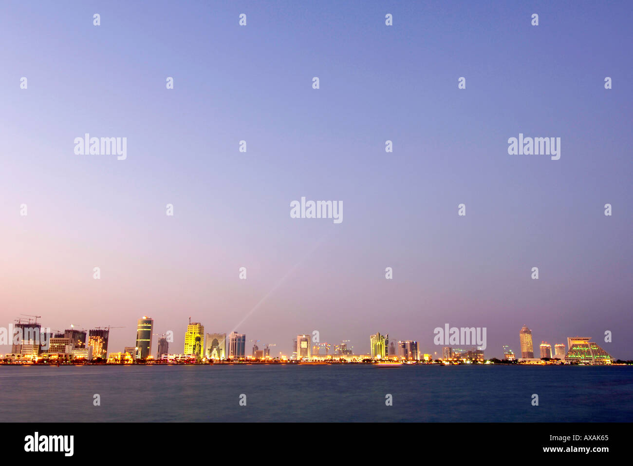 A dusk view of the skyline along West Bay in Doha, Qatar Stock Photo ...