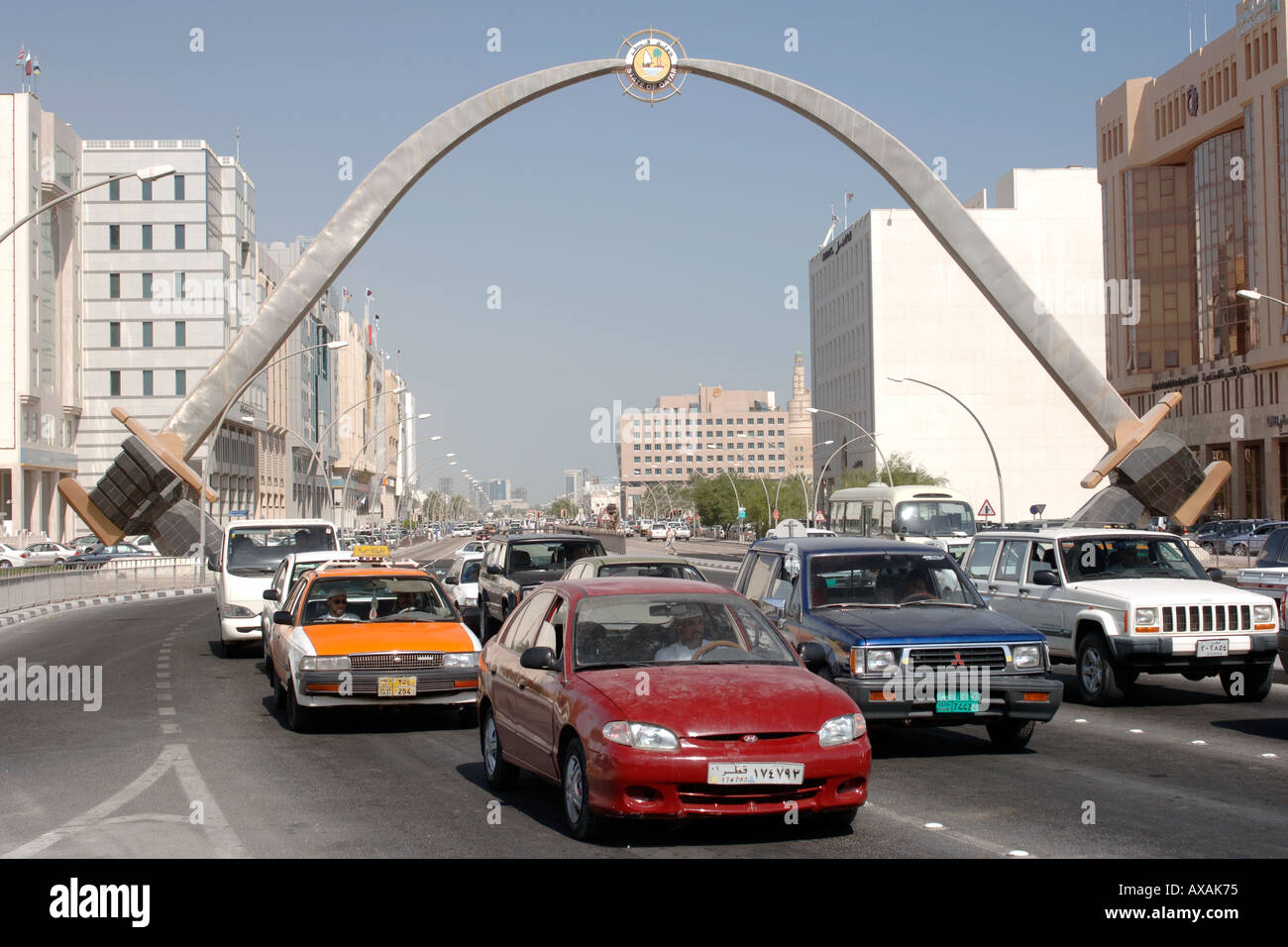 Commemorative arch over the main road in central Doha in Qatar Stock ...
