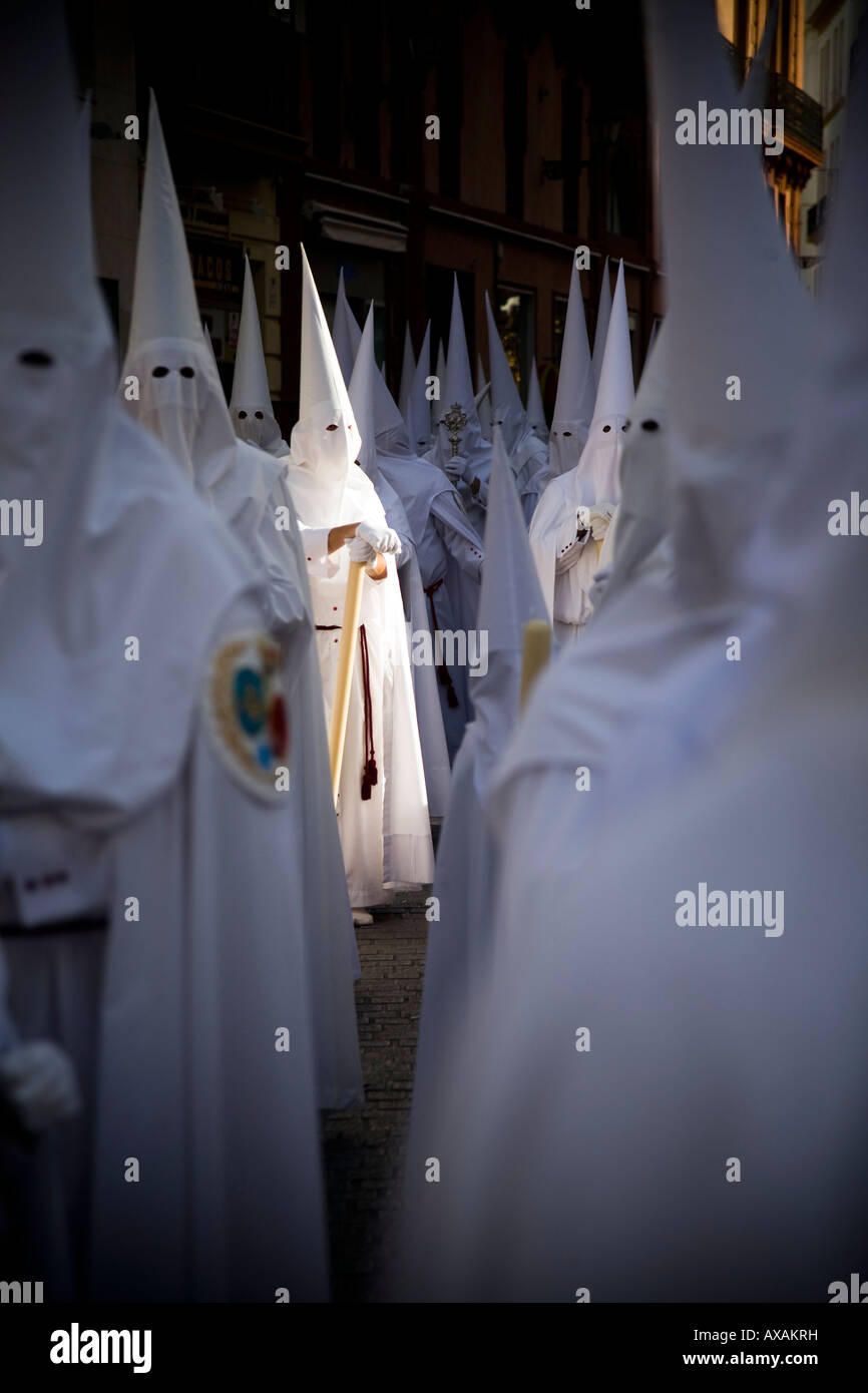 Group of hooded penitents, Palm Sunday, Seville, Spain Stock Photo - Alamy