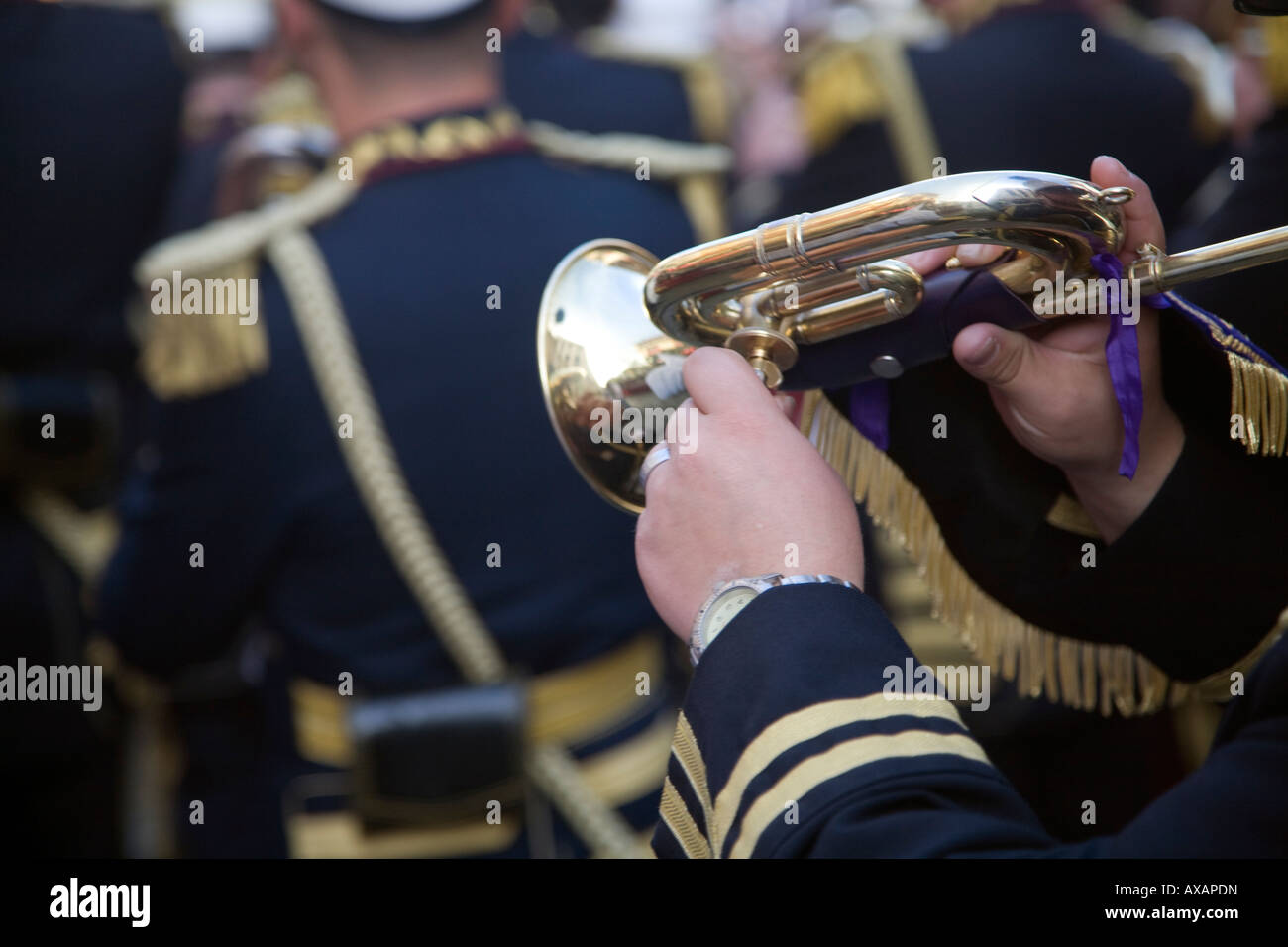 A musician handling the key of a cornet, Seville, Spain Stock Photo - Alamy