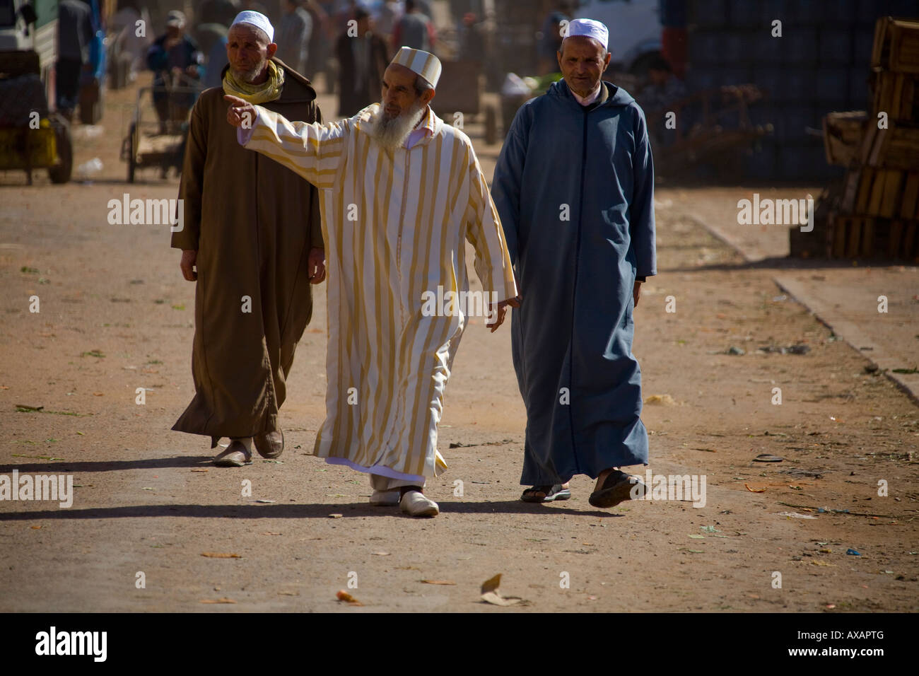 Agadir market, Morocco, West Africa. Men in jelaba walking, facing ...