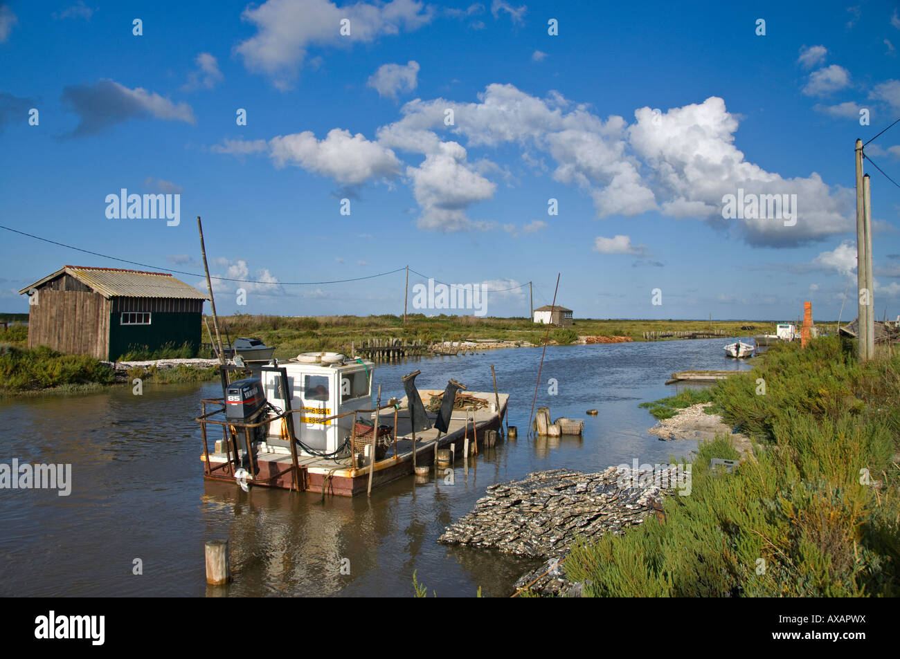 Oyster-farming boat at his moorings in Arceau channel ,Oleron Island ...