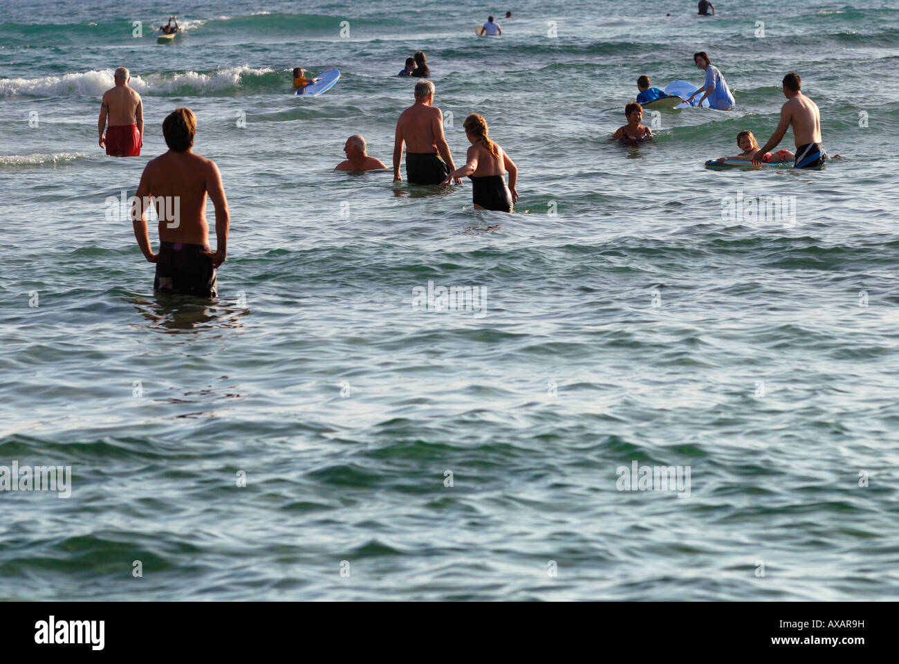People wading out into the ocean, Waikiki Beach, Hawaii Stock Photo - Alamy