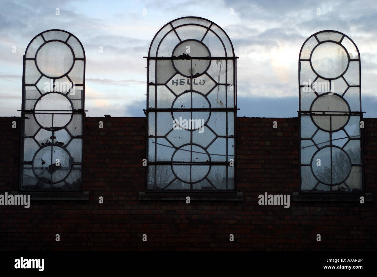 three lead windows in a derelict building in the middle of demolishment ...
