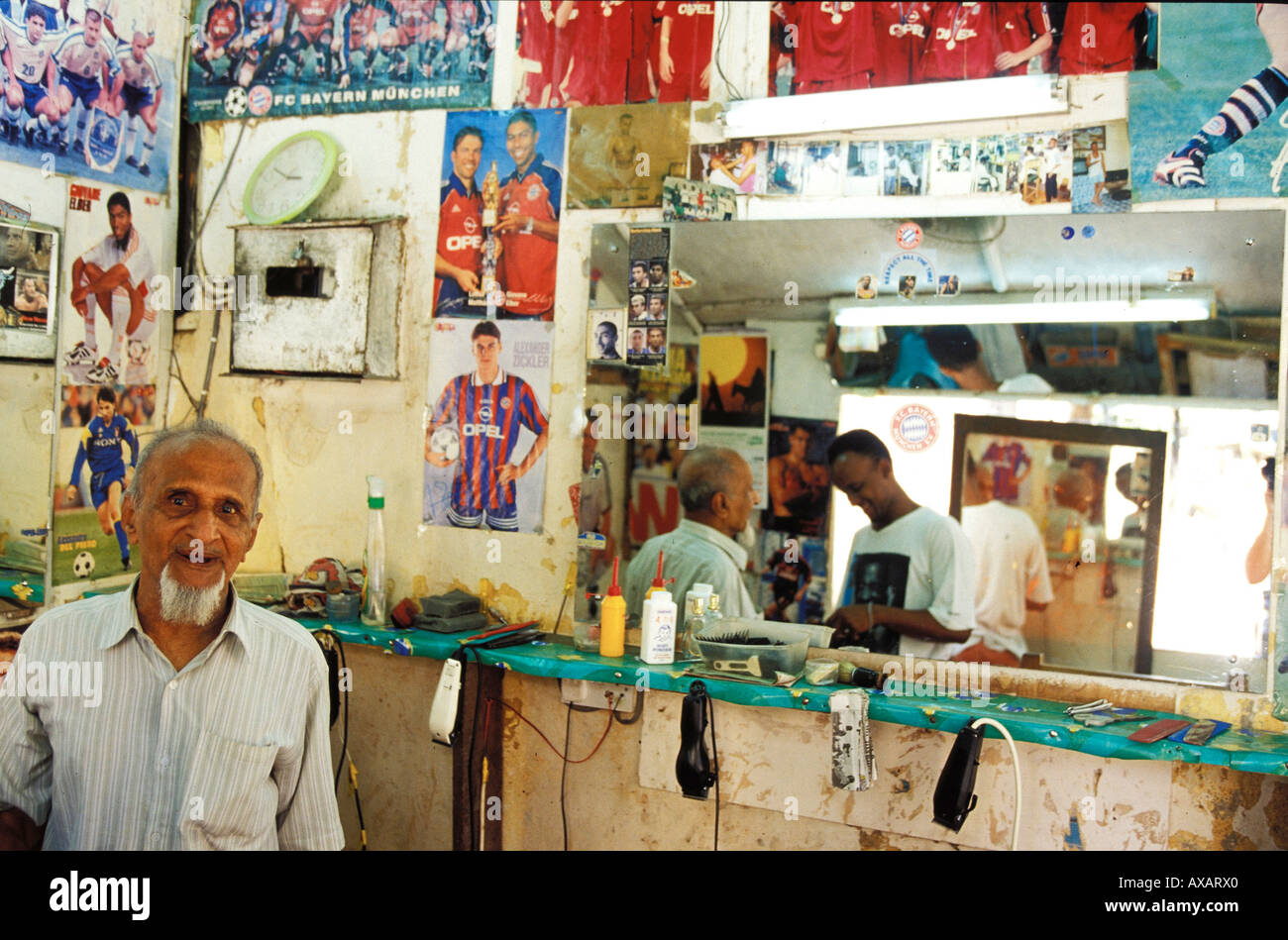 Old man at barber`s, people in shop Stock Photo - Alamy