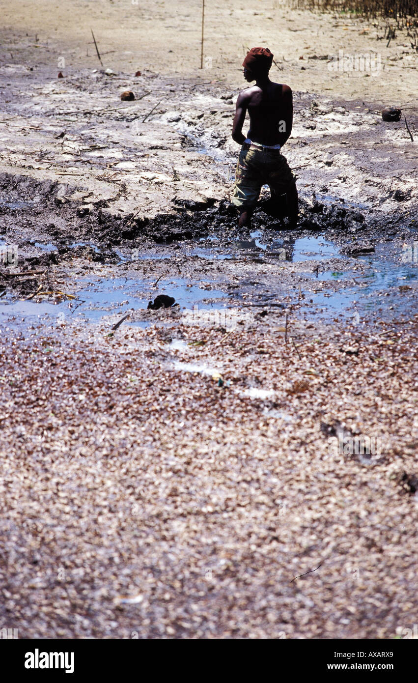 African boy digging hole, people at work Stock Photo - Alamy