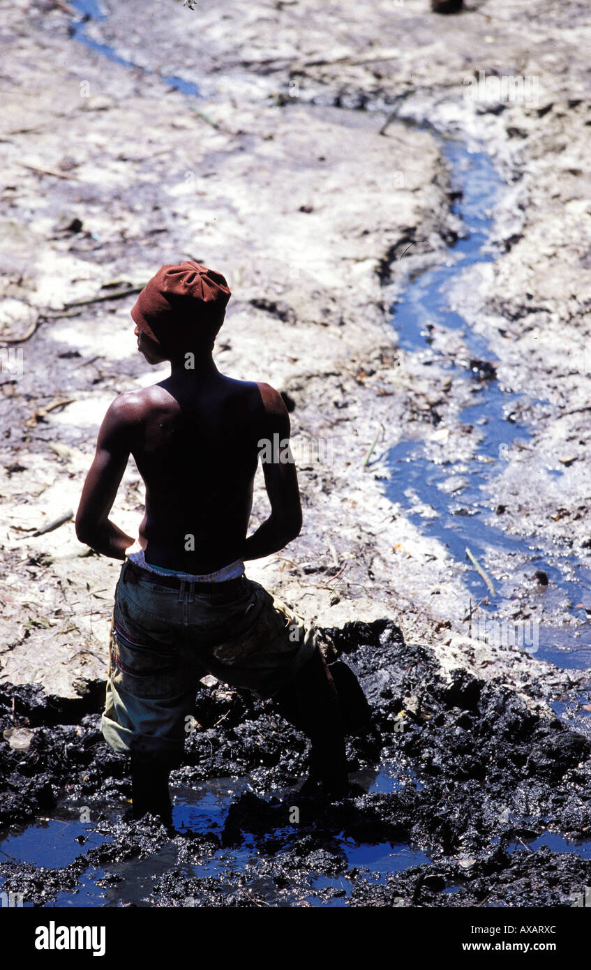 African boy digging hole, people at work Stock Photo - Alamy
