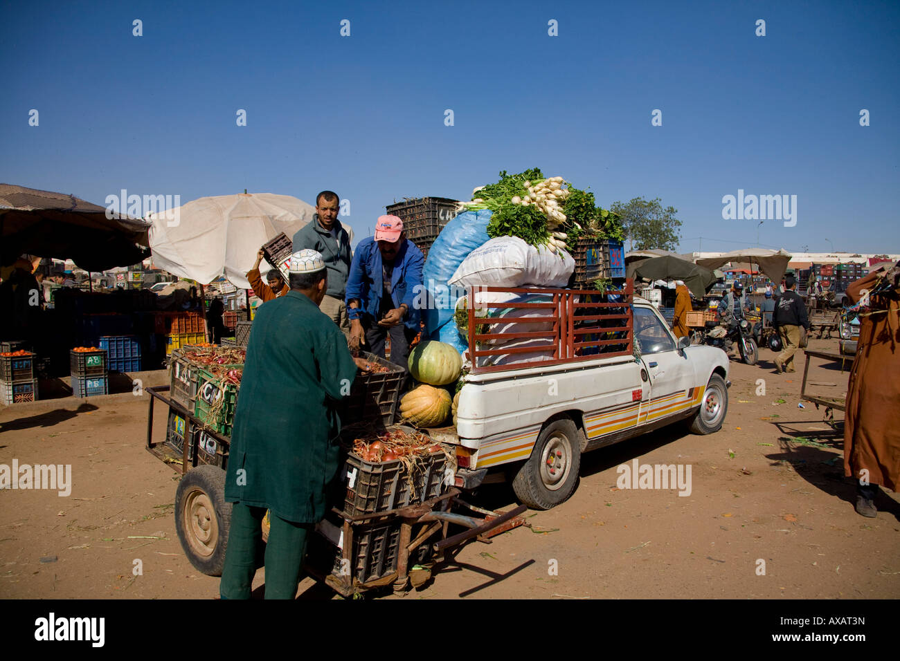 Agadir market, Morocco, West Africa. Men market traders loading truck ...